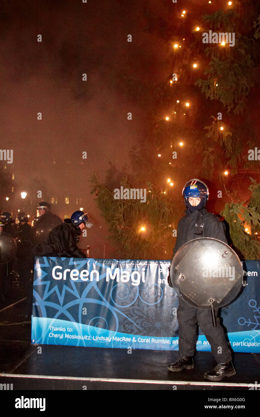 Protesters set fire to the Christmas Tree in Trafalgar Square during a ...