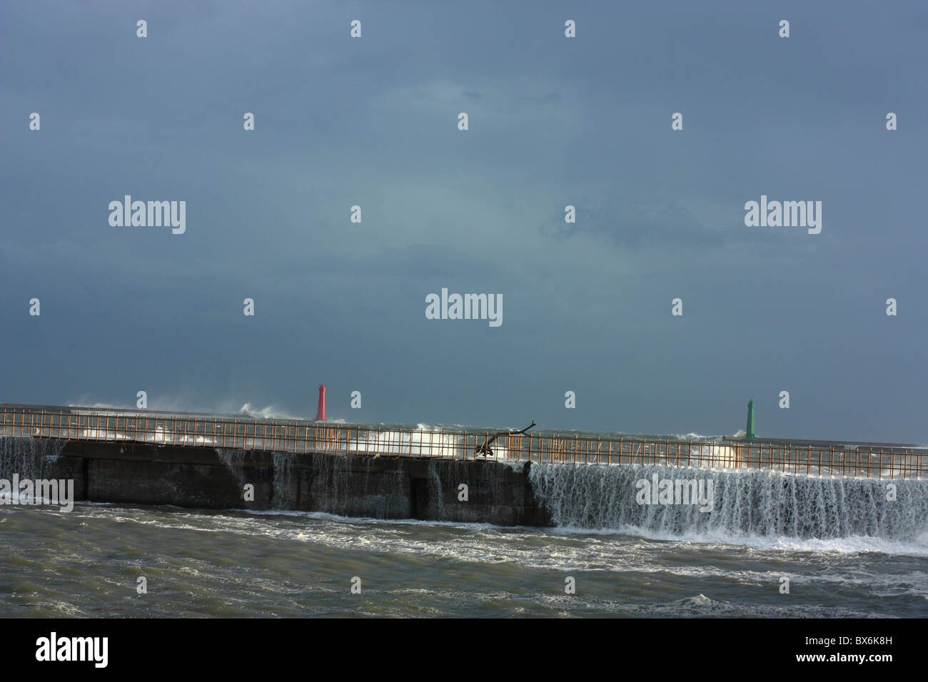 Waves pound AnPing Port ahead of Typhoon Linfa. Tainan, Taiwan. June 20 ...