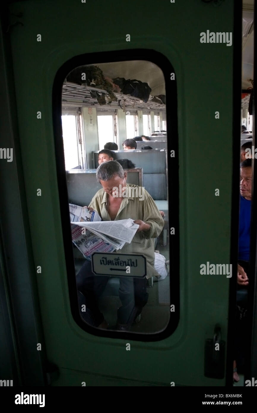 Man train reading newspaper hi-res stock photography and images - Alamy