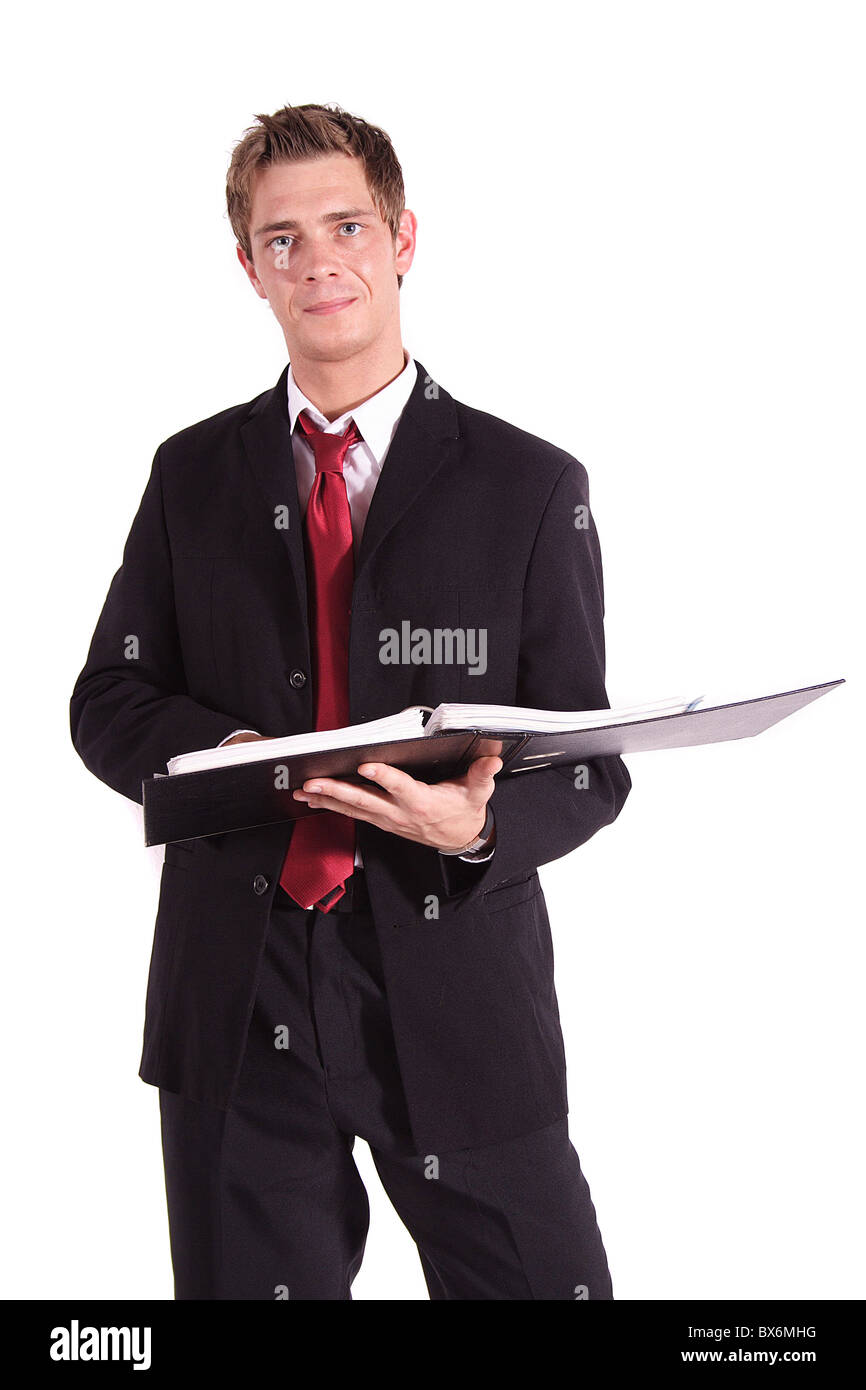 A smart businessman reviewing some files. All isolated on white ...