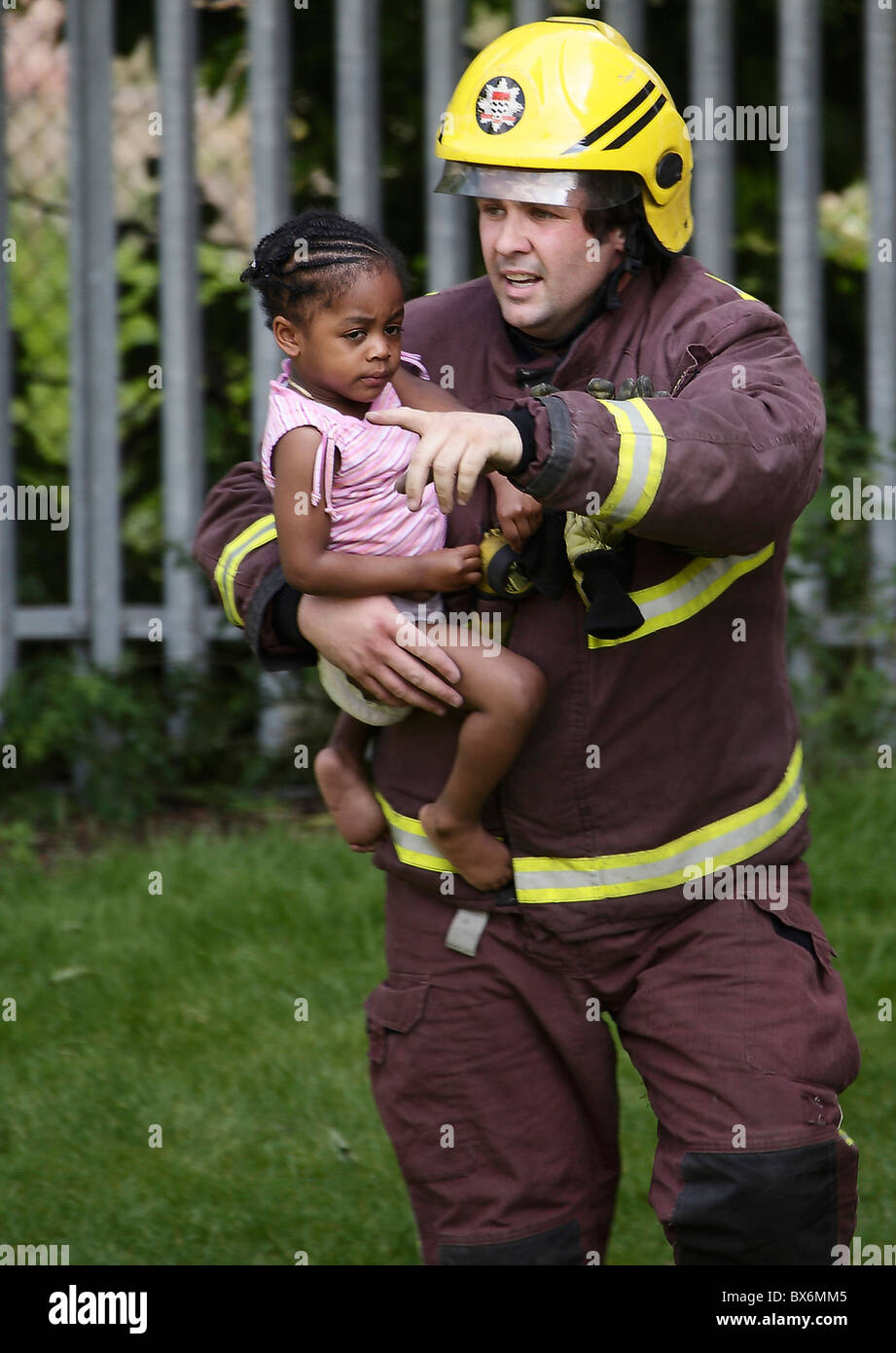 Firefighter Carrying Child