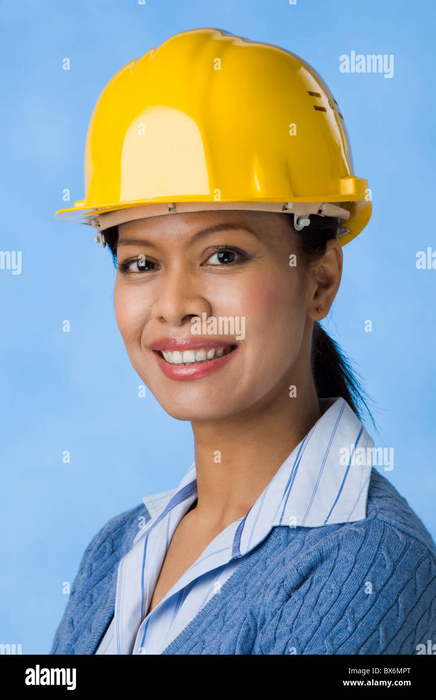 Portrait of pretty female with helmet on head looking at camera Stock ...