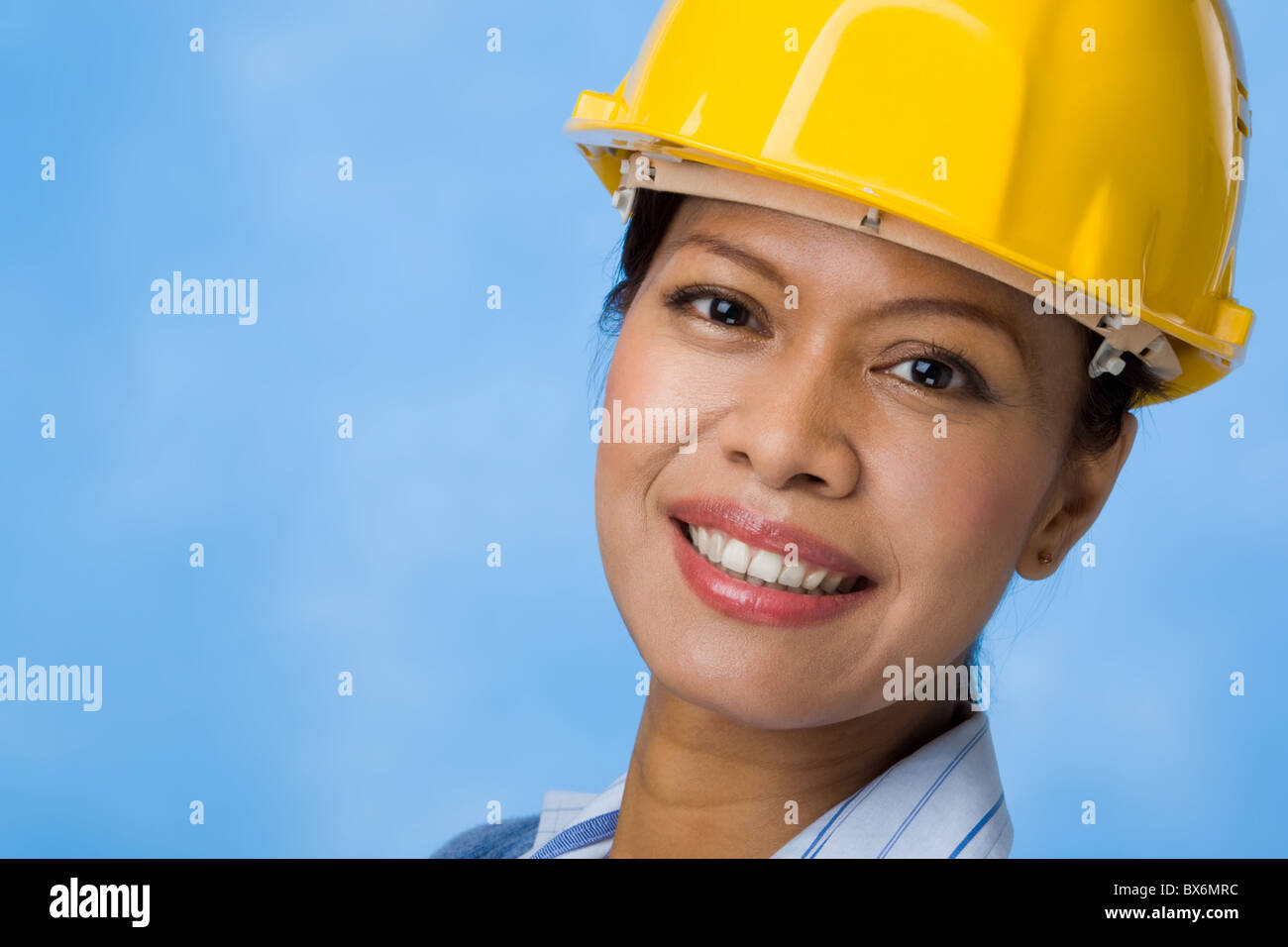 Portrait of pretty female with helmet on head looking at camera Stock ...
