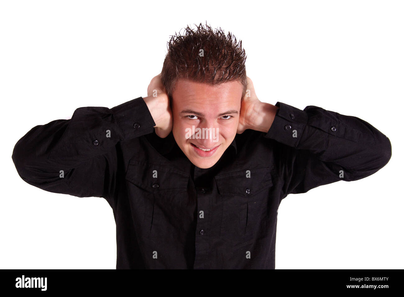 A young man suffers from extreme noise. All isolated on white ...