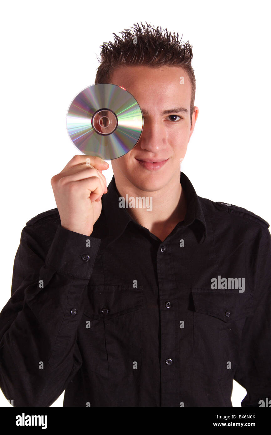 A young handsome man holding a cd or dvd. All isolated on white ...