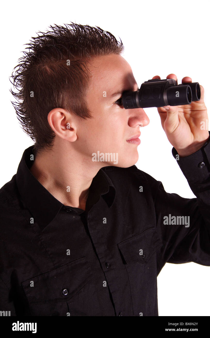 A young man using binoculars. All isolated on white background Stock ...