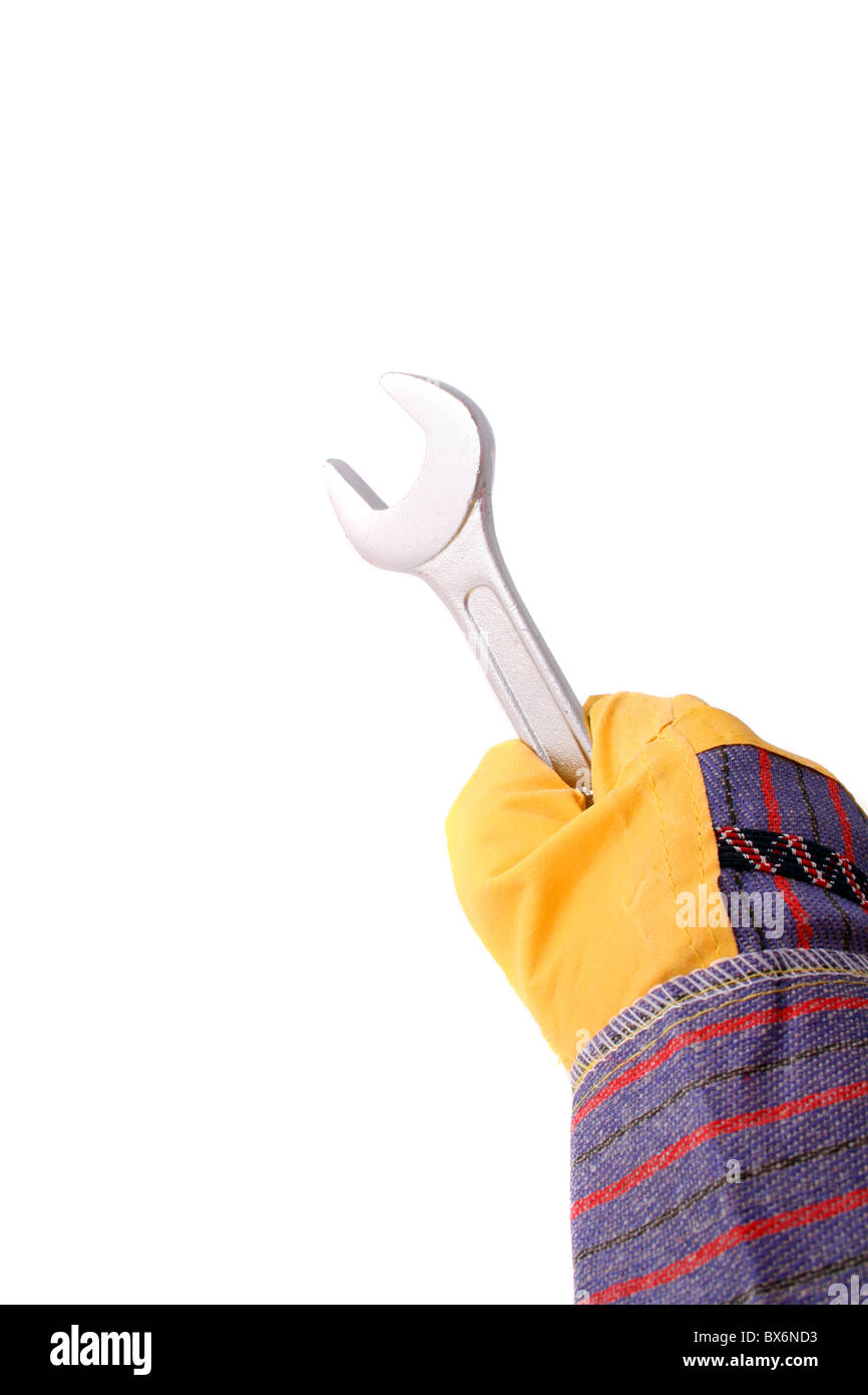 A hand in gauntlet holding a open-end wrench. All isolated on white ...