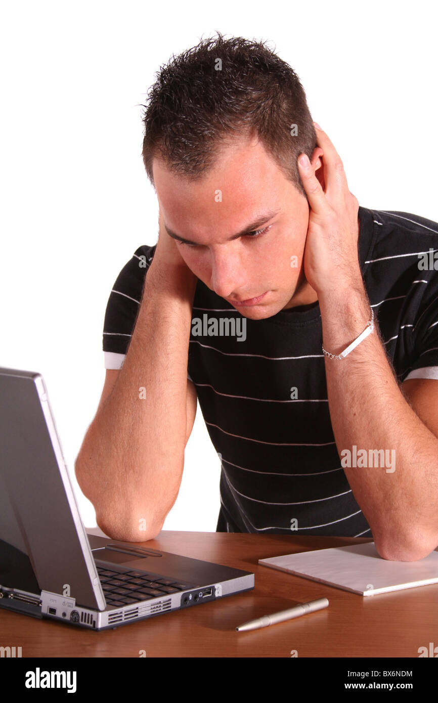 A handsome young student in desperate mood. All isolated on white ...