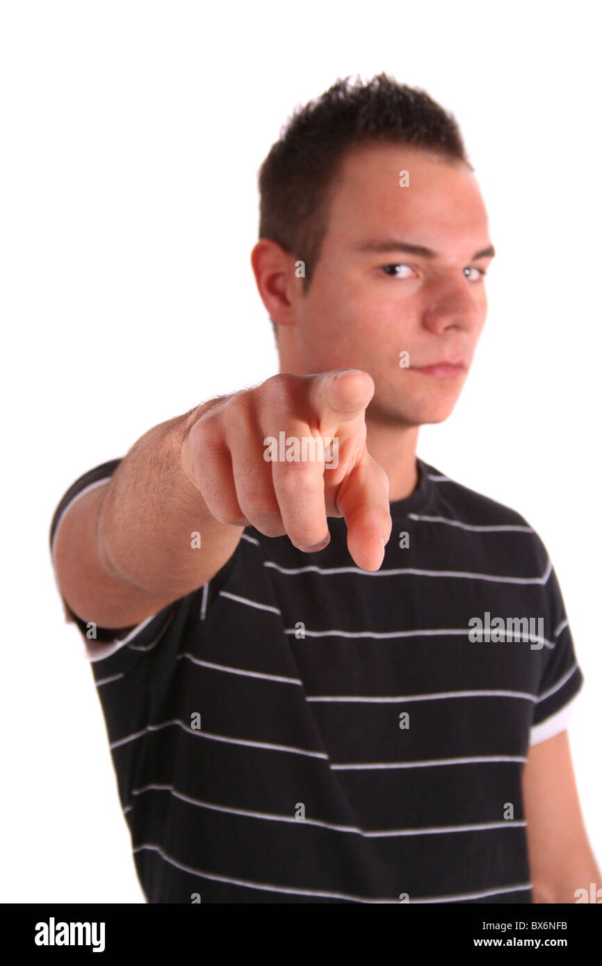 A handsome young man pointing at someone or something. All isolated on ...