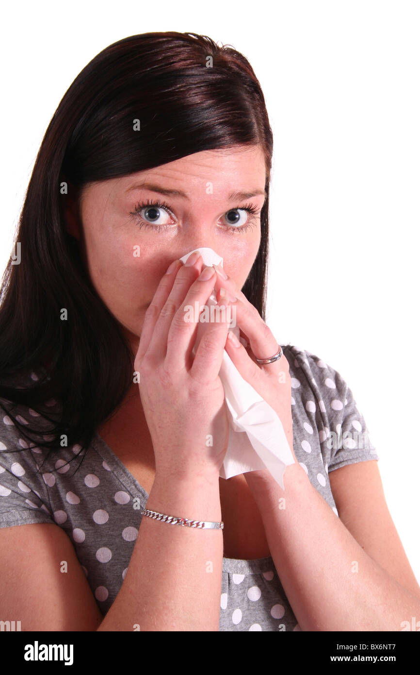 Attractive young woman using a tissue. All on white background Stock ...