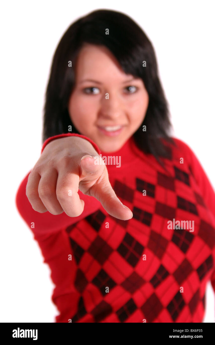 An attractive young woman pointing at someone. All isolated on white ...