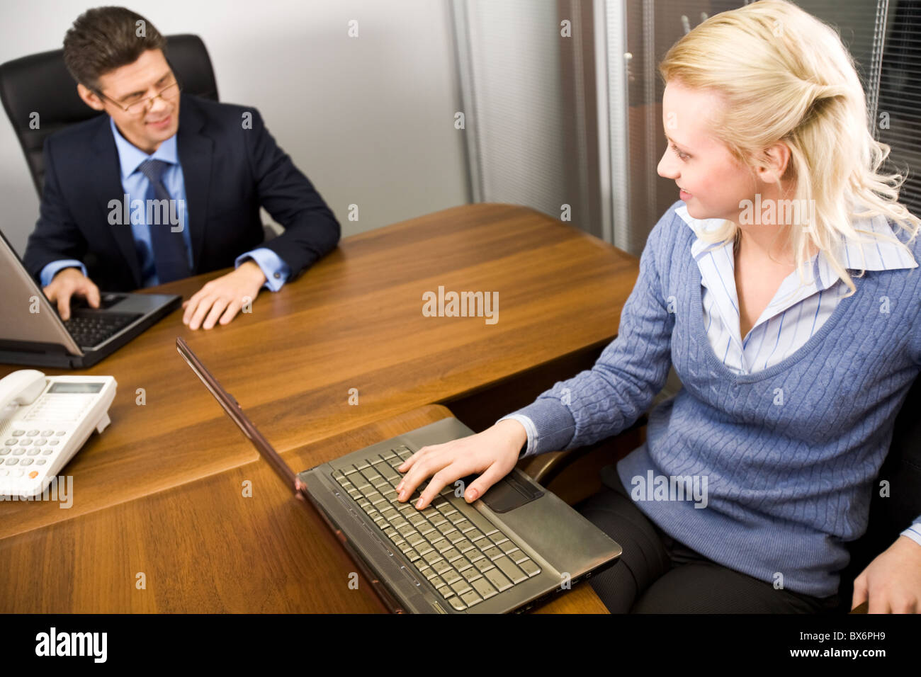 Image of secretary and boss communicating in the office at work Stock ...