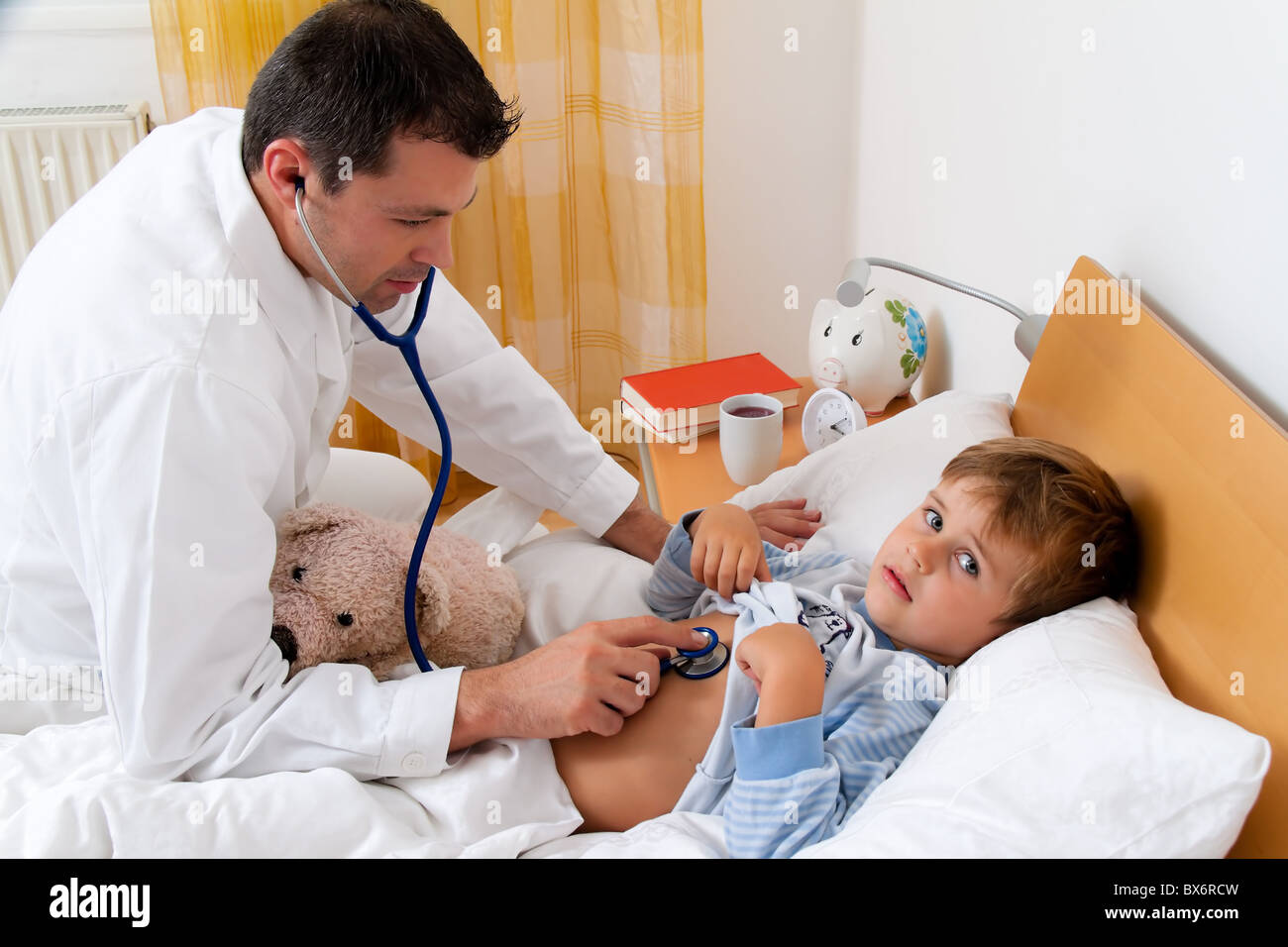 sick child in bed Stock Photo - Alamy