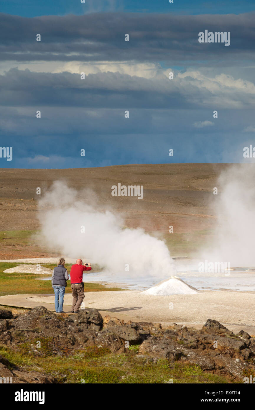 Tourists taking pictures of Oskurholshver (screaming spring), famous ...