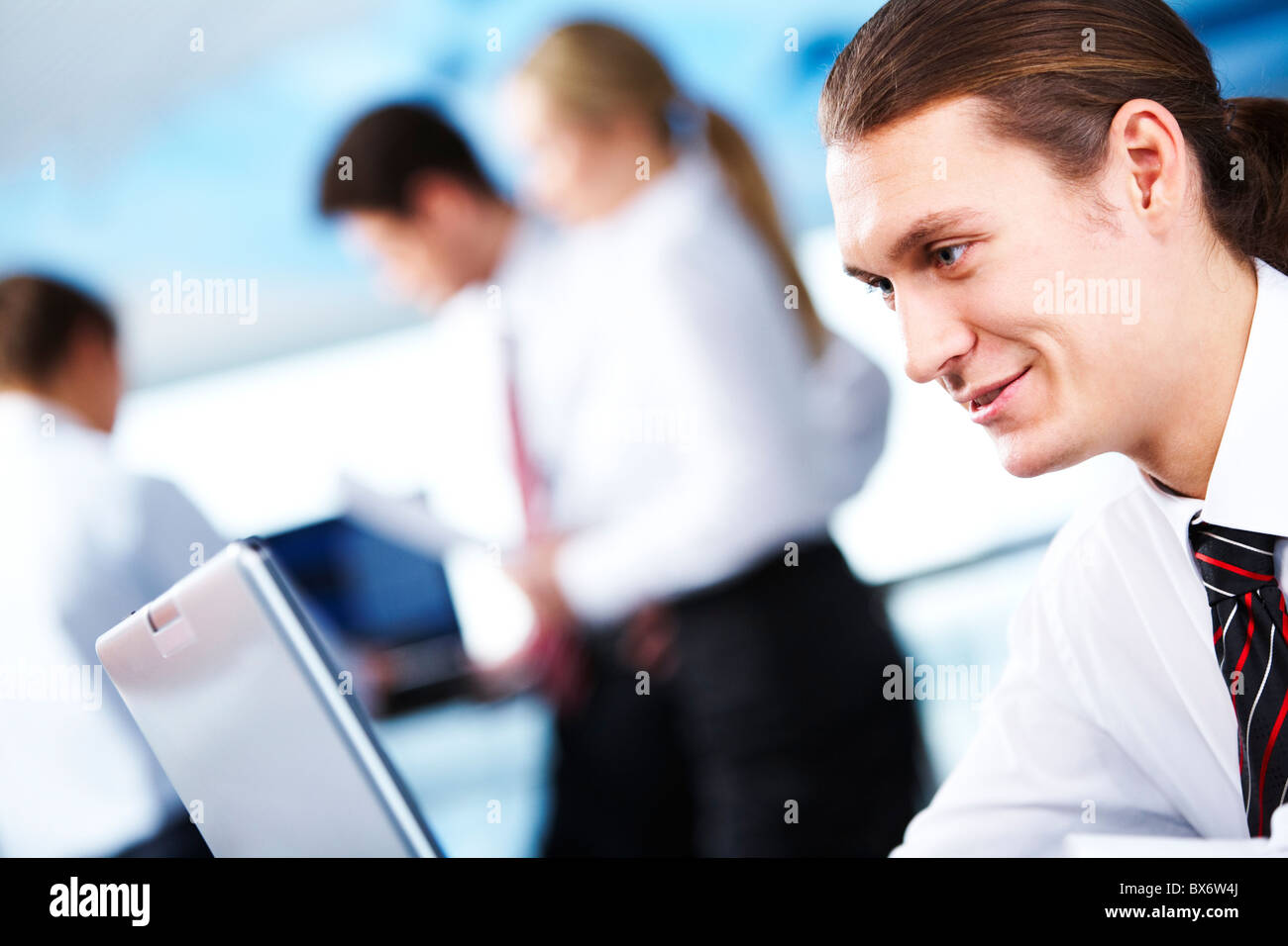 Portrait of busy chief working on background of communicating partners ...