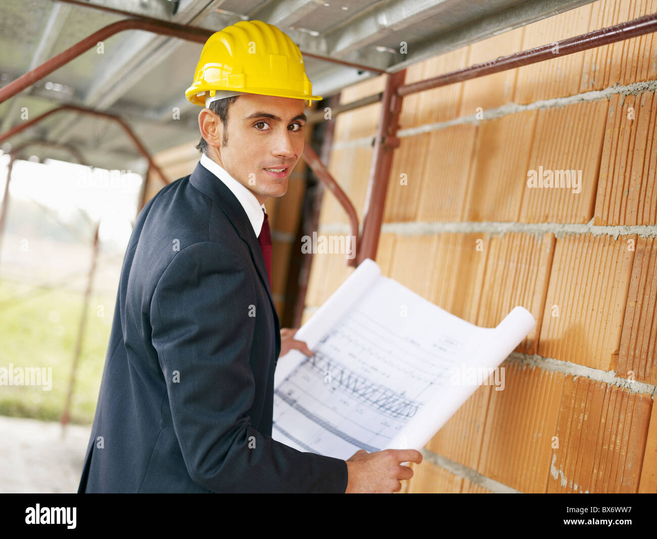 architect with blueprint in construction site Stock Photo - Alamy