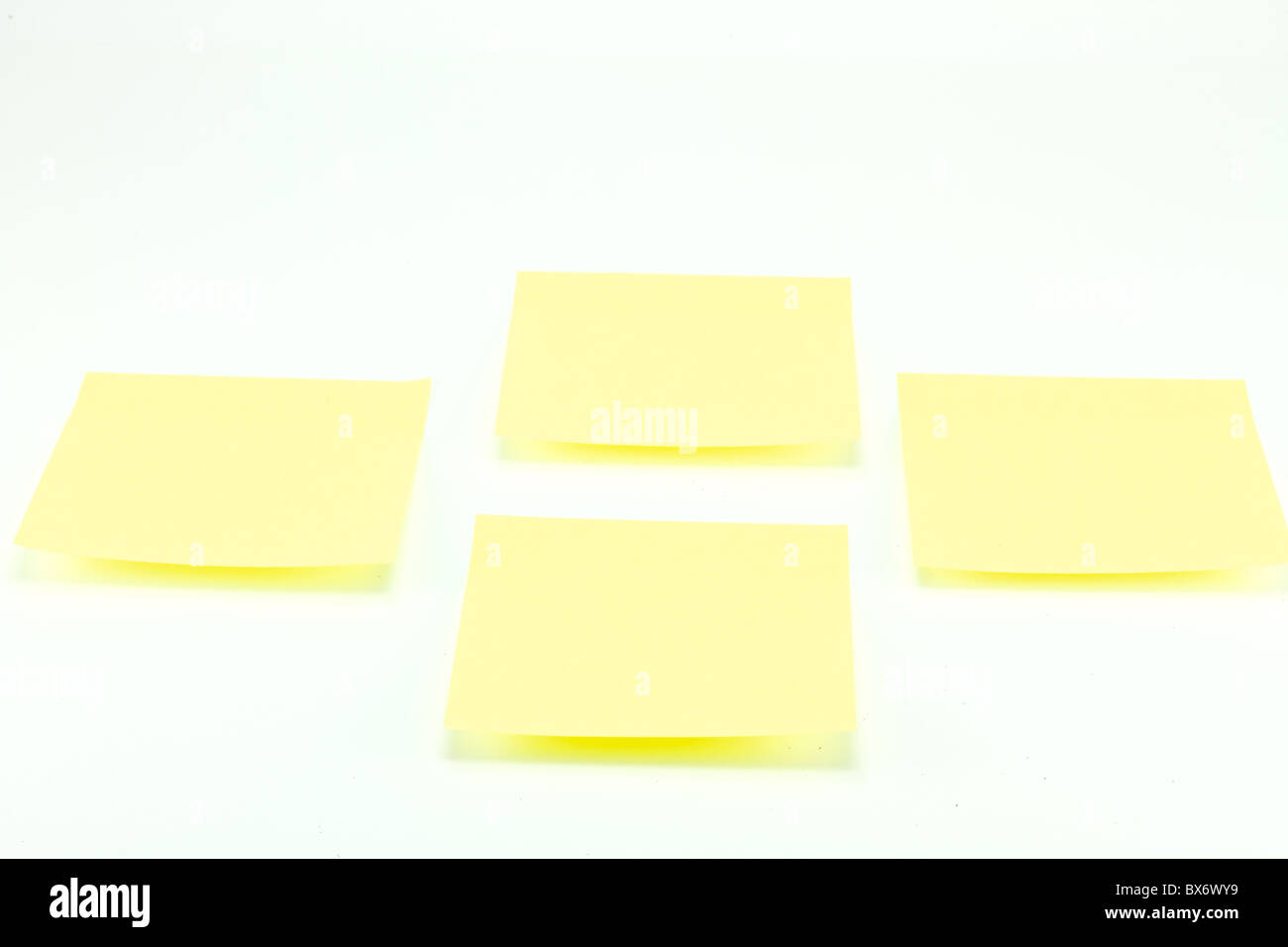 Yellow memo stick isolated on white background Stock Photo - Alamy