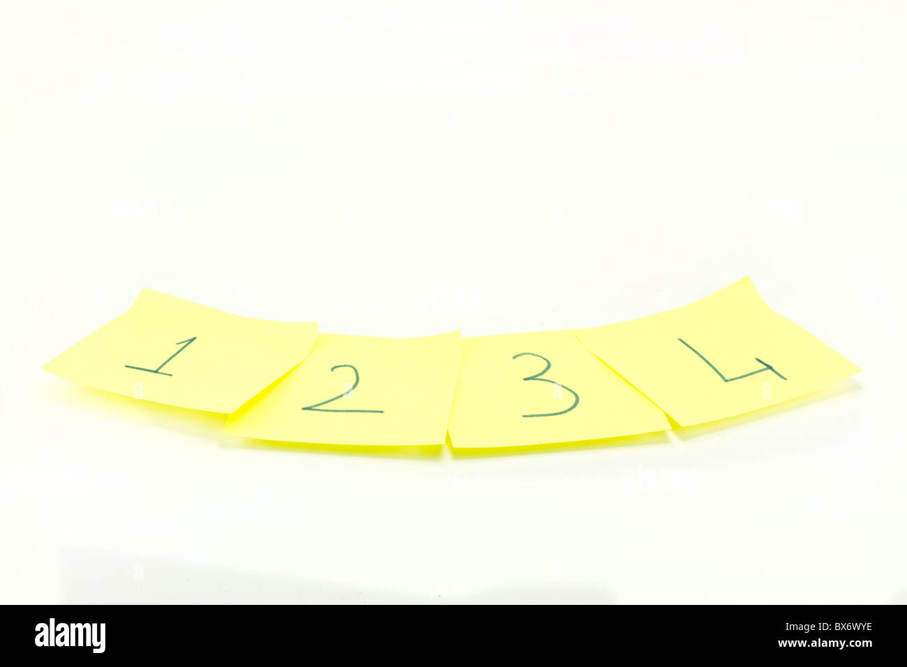 Yellow memo stick isolated on white background Stock Photo - Alamy