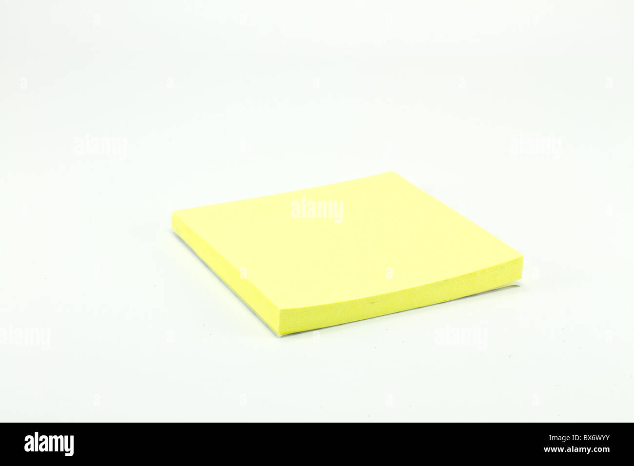 Yellow memo stick isolated on white background Stock Photo - Alamy