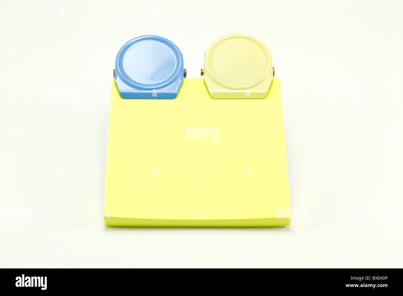 Yellow memo stick isolated on white background Stock Photo - Alamy