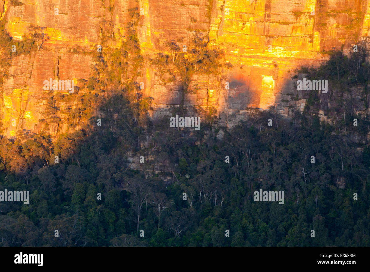 Shadows of Three Sisters at sunrise, Jamison Valley, Blue Mountains ...