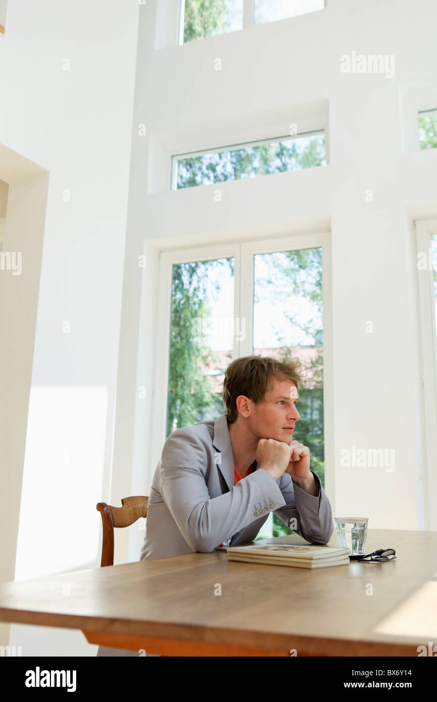 Young man contemplating Stock Photo - Alamy