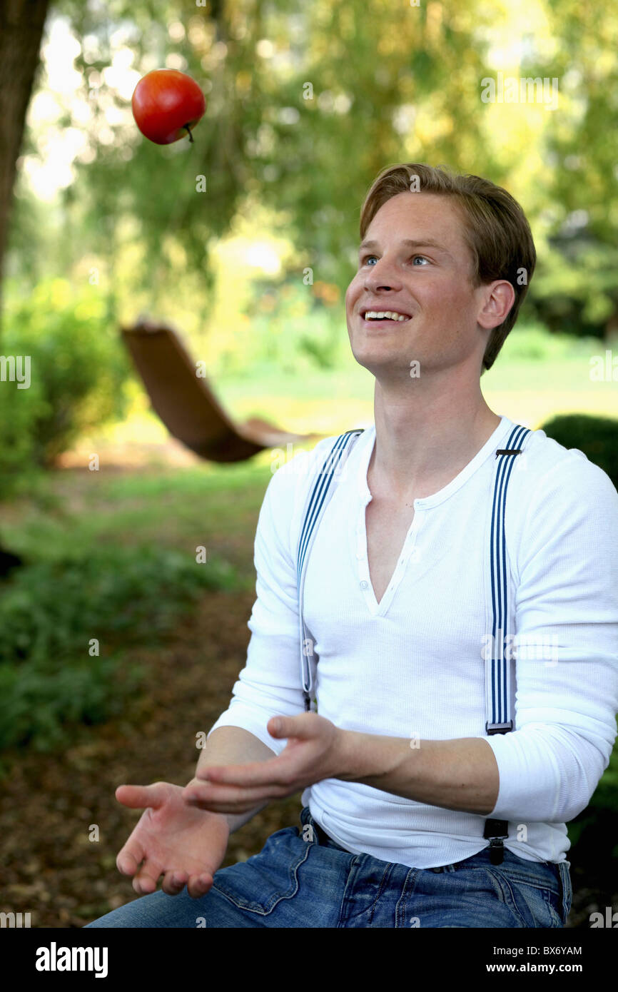 Man throwing apple hi-res stock photography and images - Alamy
