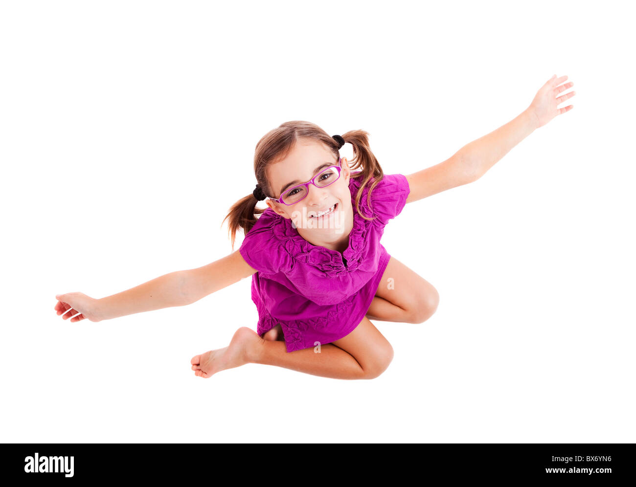 Top view of a happy girl sitting on floor with arms open Stock Photo ...