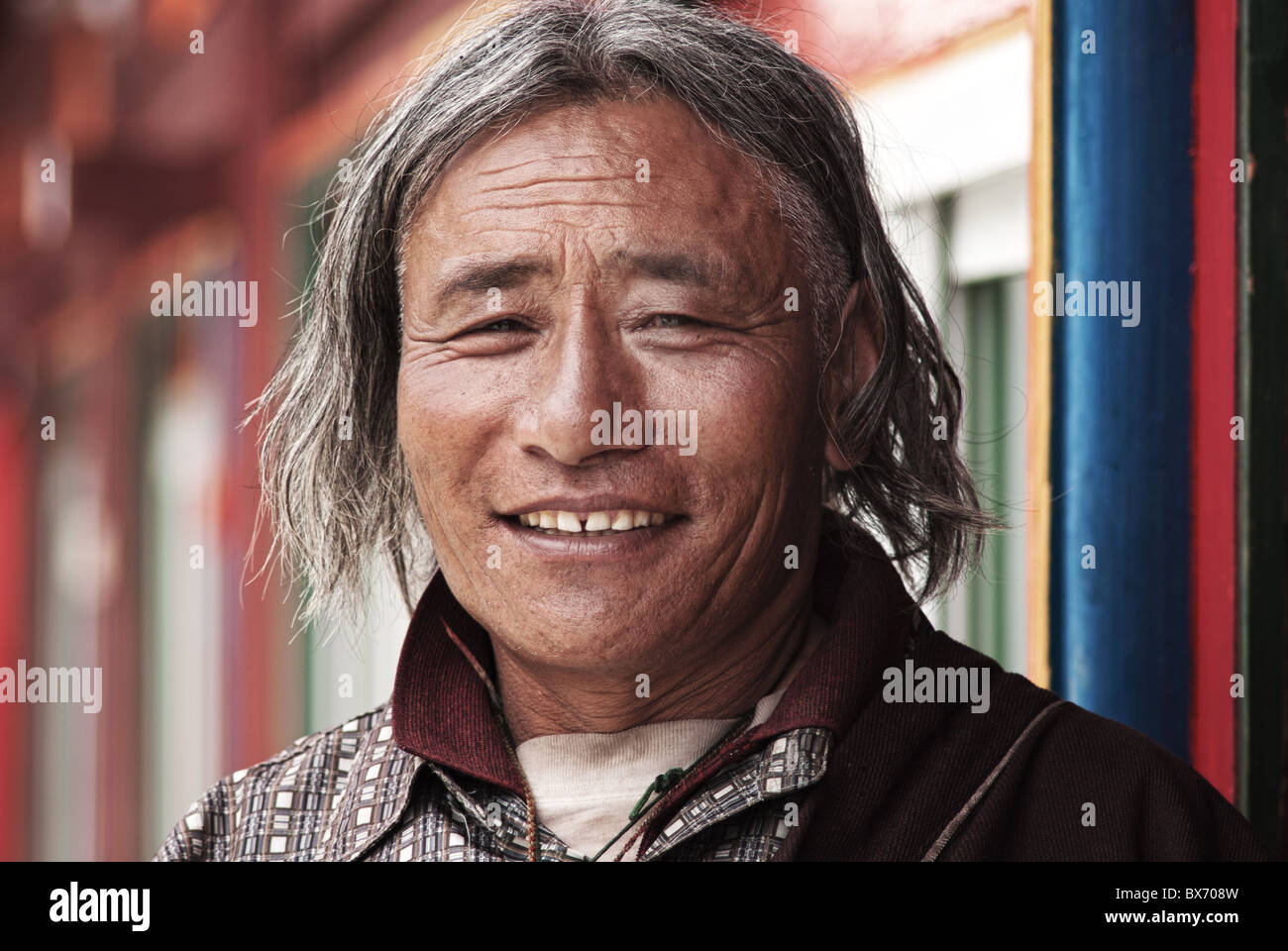 Smiling tibetan man in traditional dress,sichuan,china Stock Photo - Alamy