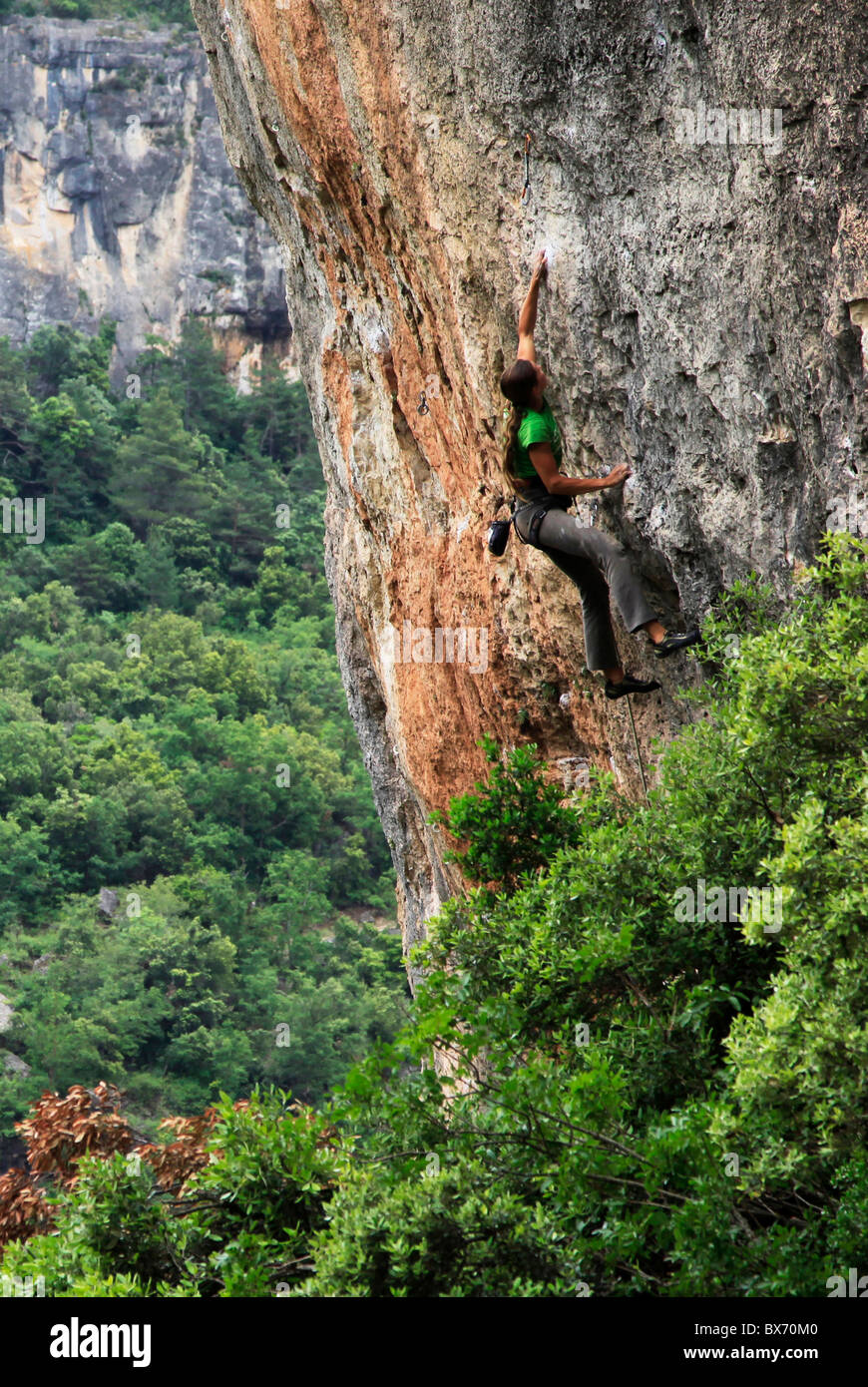 A woman tackles a very difficult climb on limestone cliffs near ...