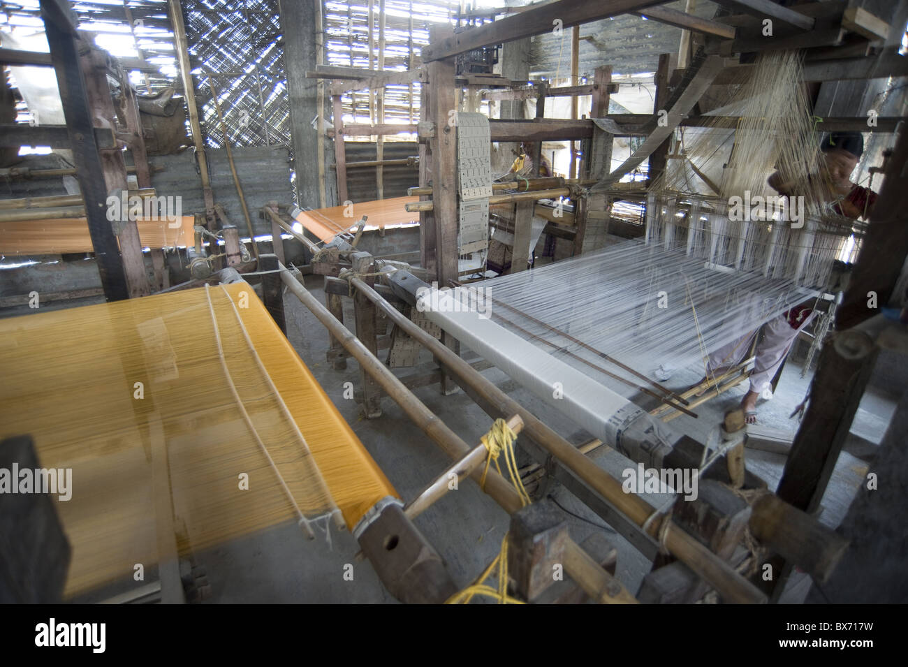 Women at village silk loom weaving Assam Muga natural undyed silk in ...