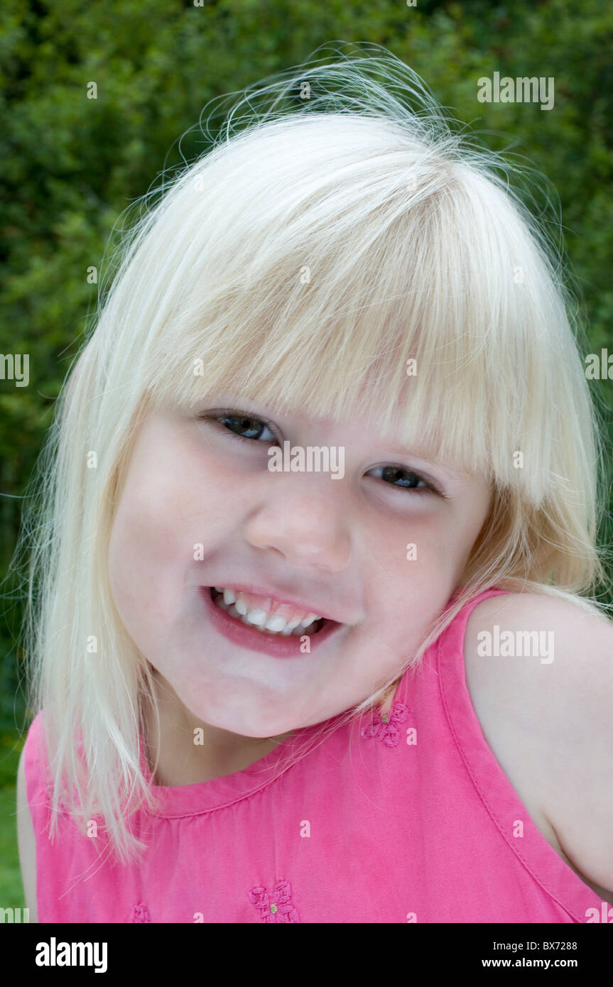 Girl smiling with cute pose Stock Photo - Alamy