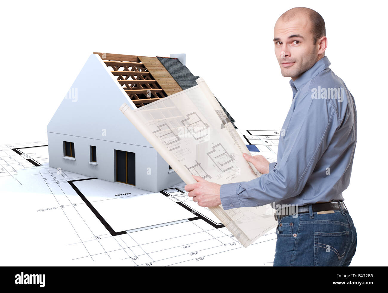 Man holding plans and house in construction at the background Stock ...