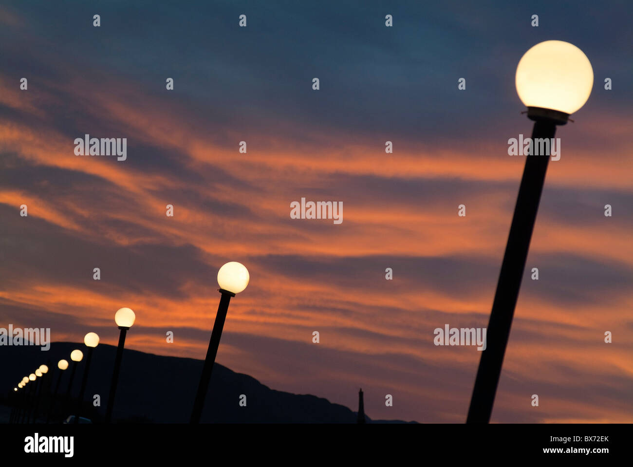 Illuminated row of street lights at sunset, Red Sea, Egypt Stock Photo ...