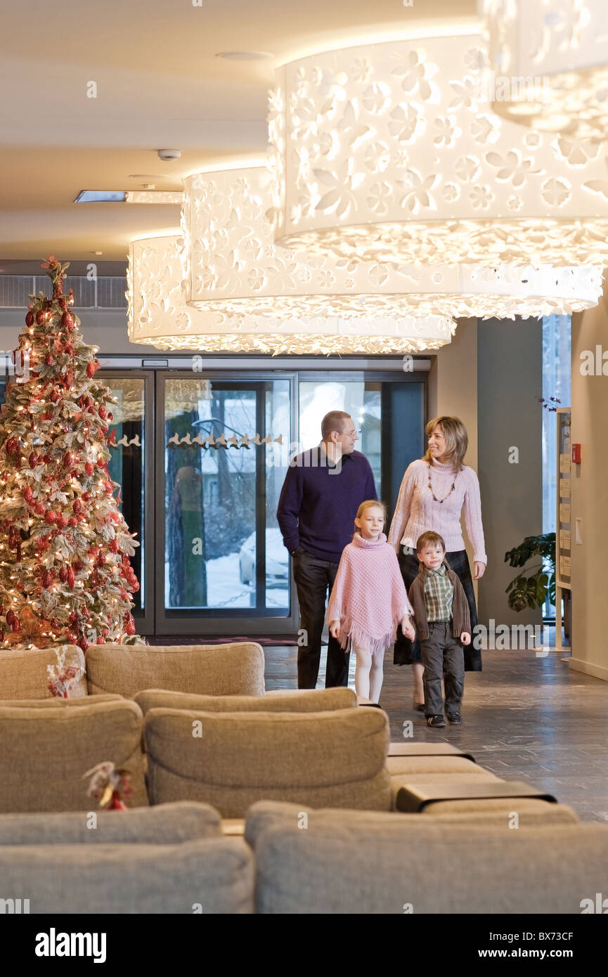 Happy family walking at foyer in the modern hotel Stock Photo - Alamy