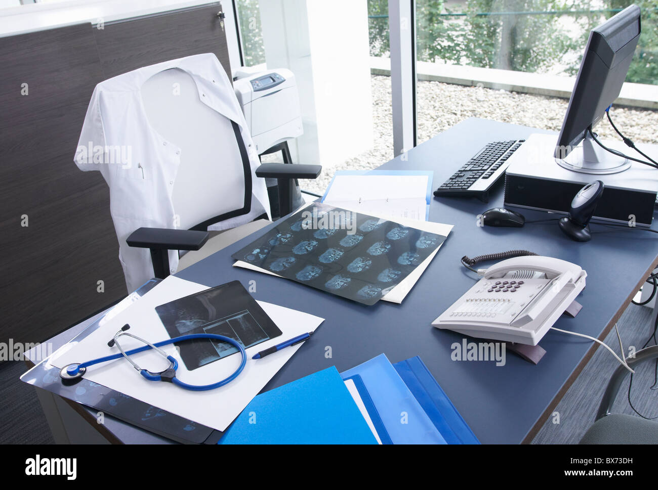 Doctor's desk, x-rays & stethoscope Stock Photo - Alamy