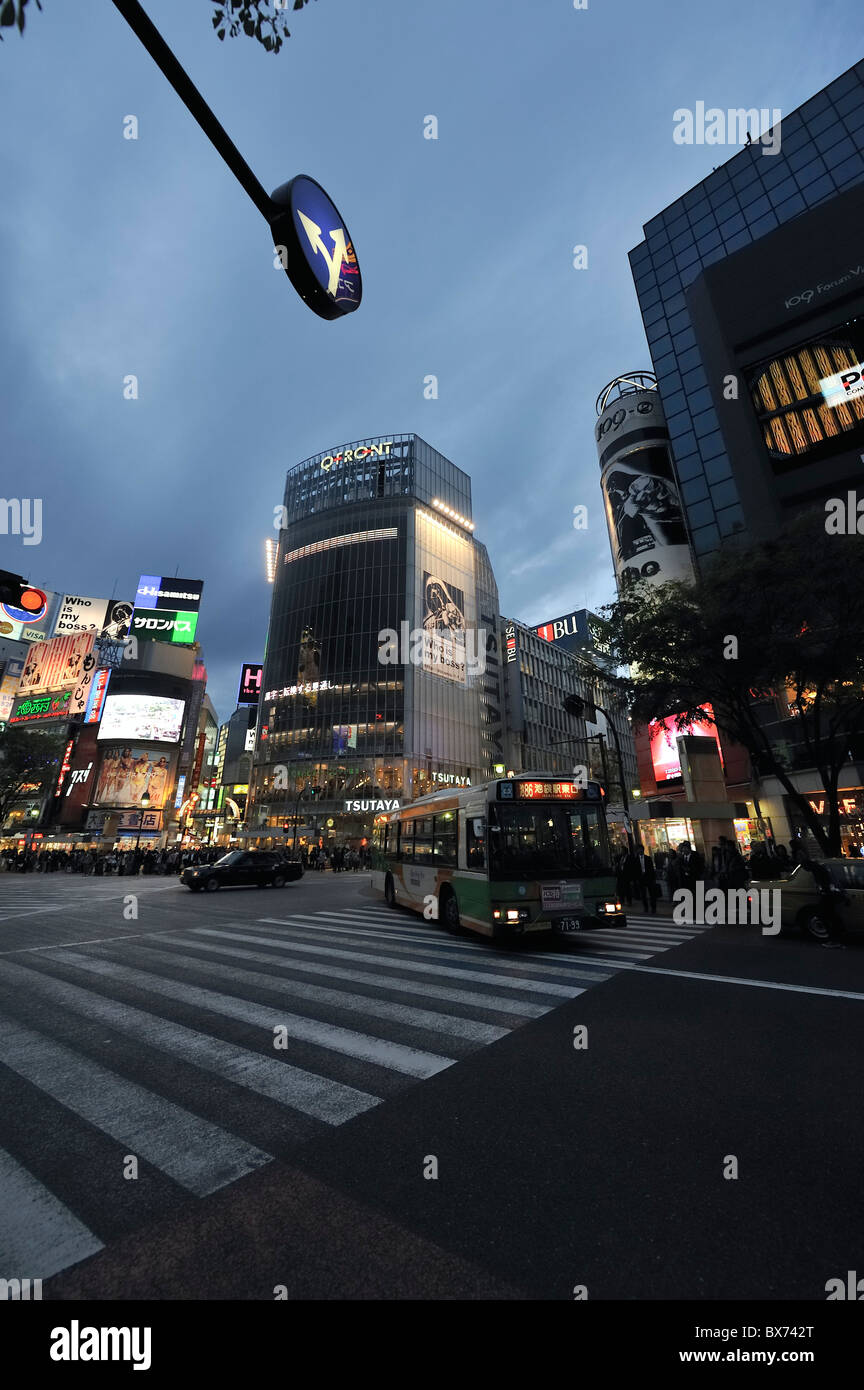 Public bus at Shibuya Crossing after sunset, Tokyo, Japan Stock Photo ...
