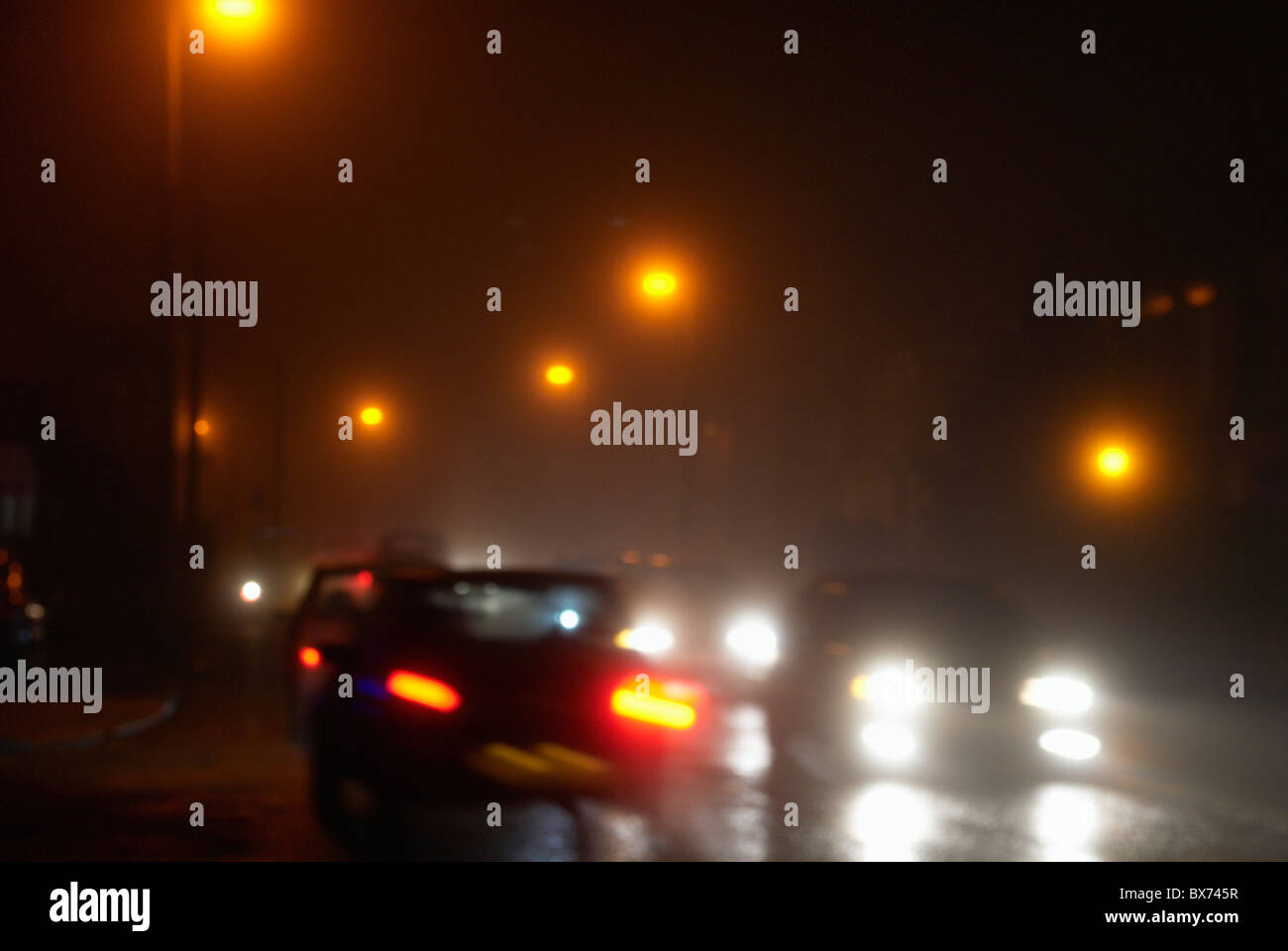 Car with fog light illuminated night UK Stock Photo - Alamy