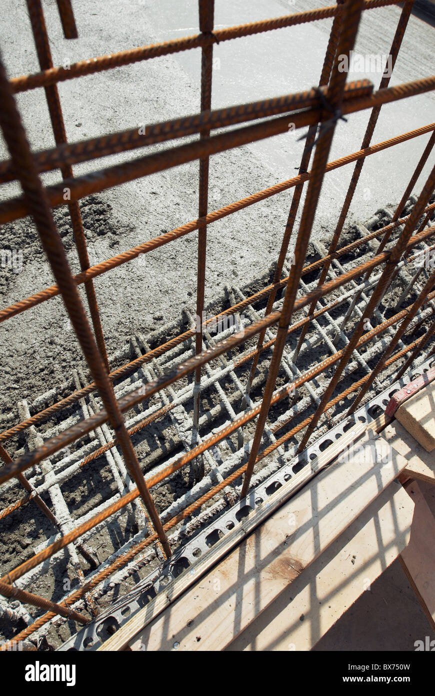 Steel rods put into place for concrete on the construction of a multi ...