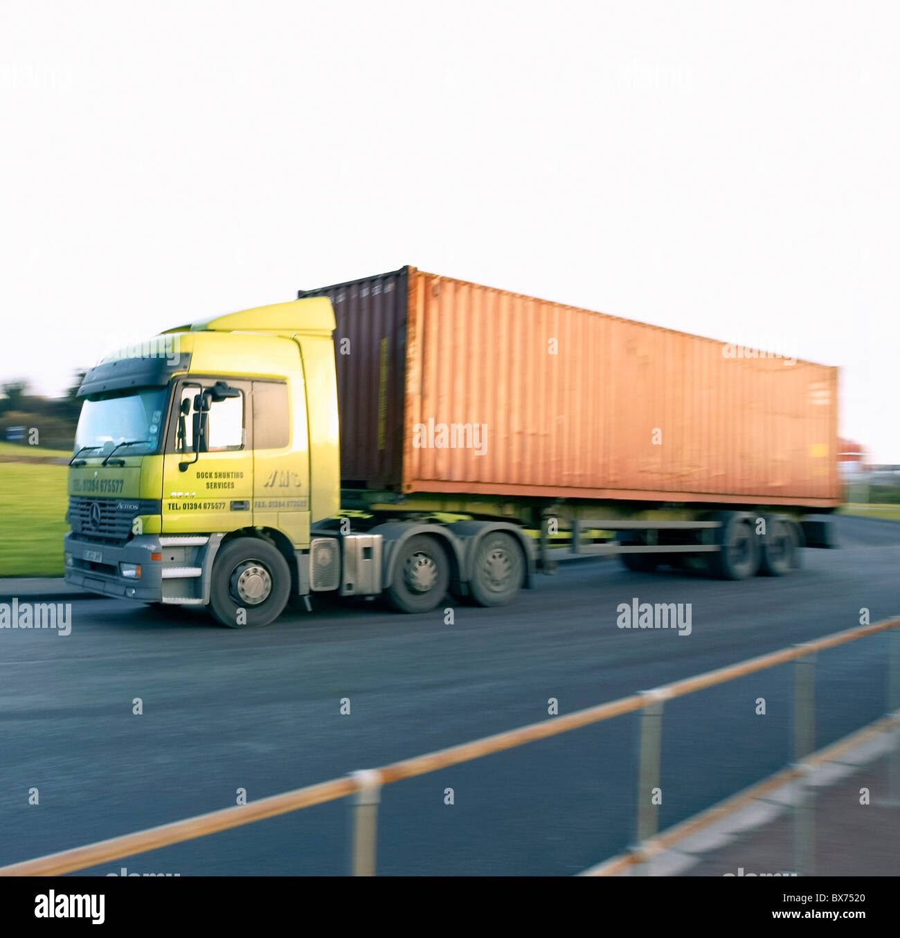 Articulated container truck on the road Stock Photo - Alamy