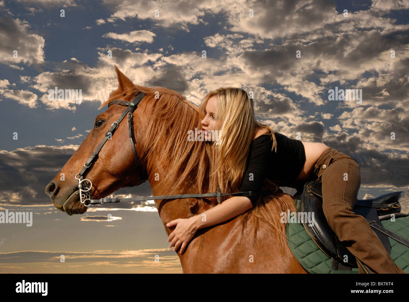 Riding horse in storm hi-res stock photography and images - Alamy