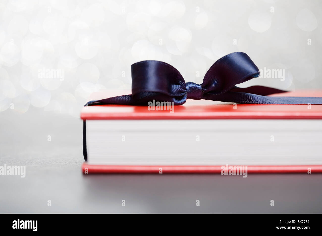 Gift wrapped book Stock Photo - Alamy