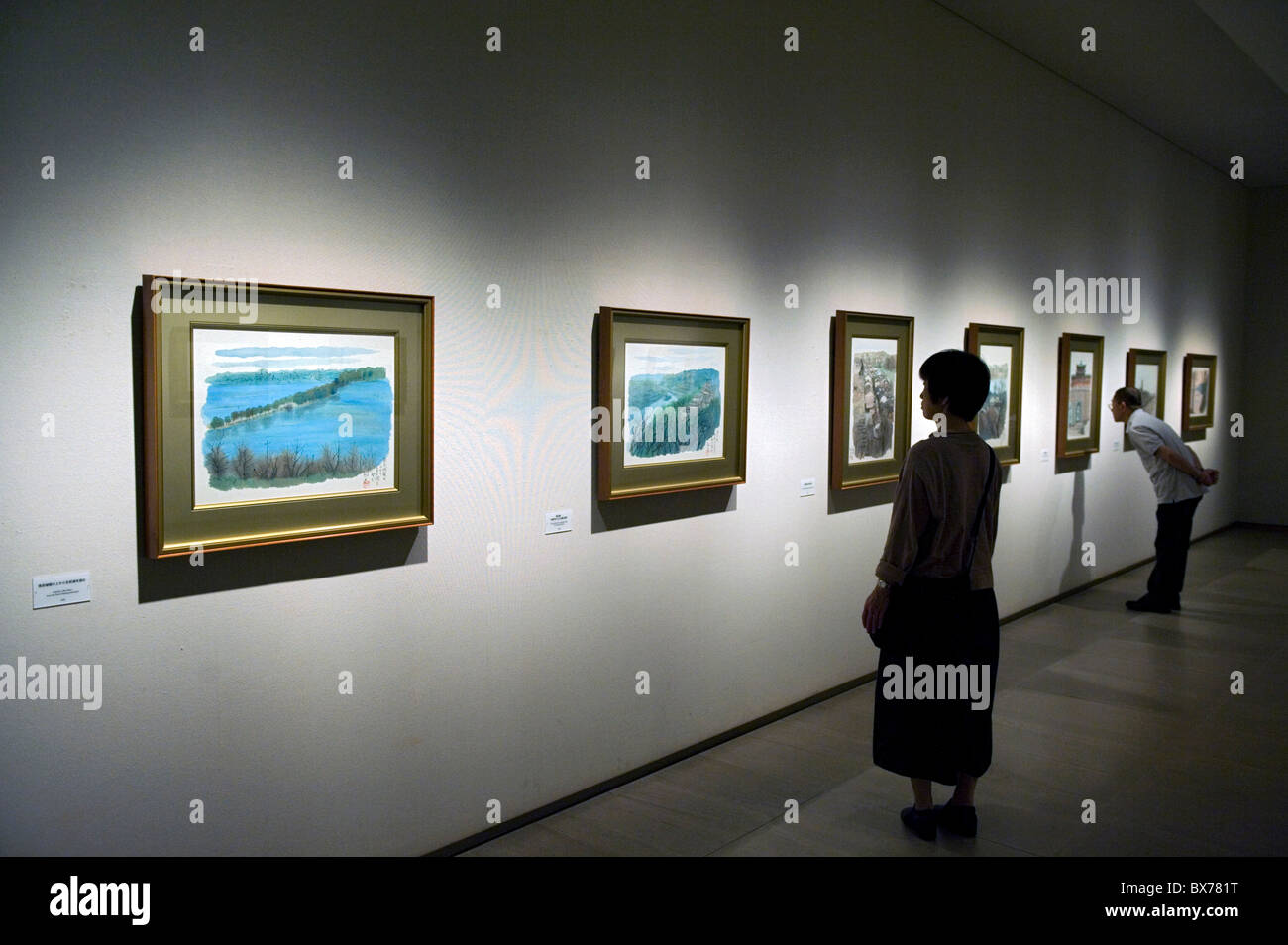 Visitors admiring paintings of Japan scenes at the Sagawa Art Museum in ...