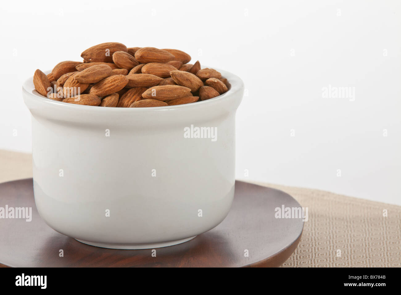 Almonds in a bowl Stock Photo - Alamy