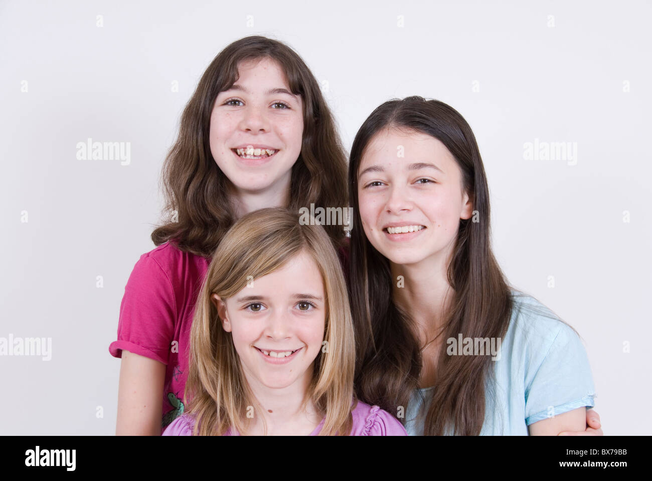 Studio Portrait Three Sisters Smiling Heads Together, Cut Out on White ...