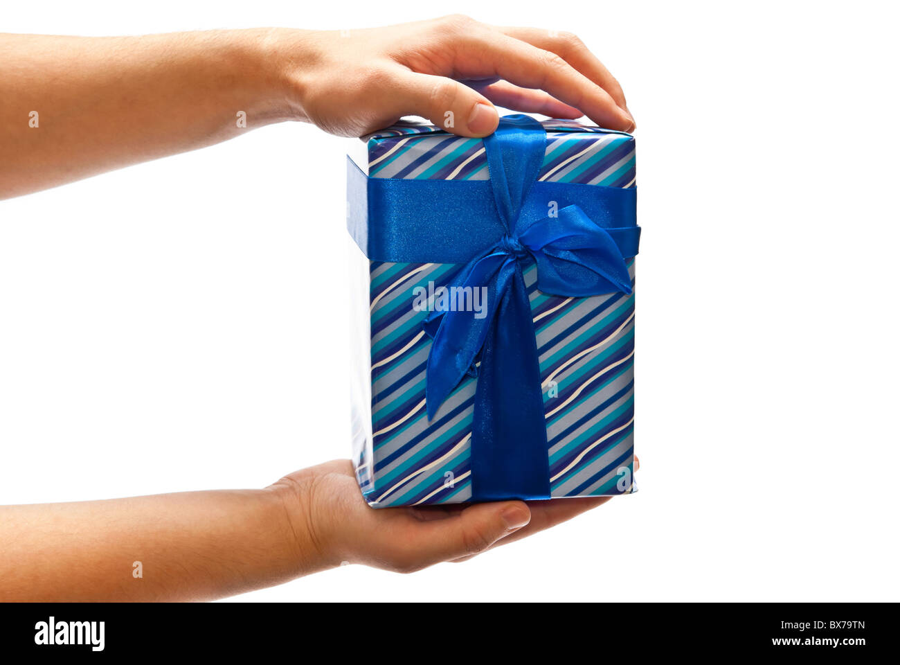 Present in hands Stock Photo - Alamy