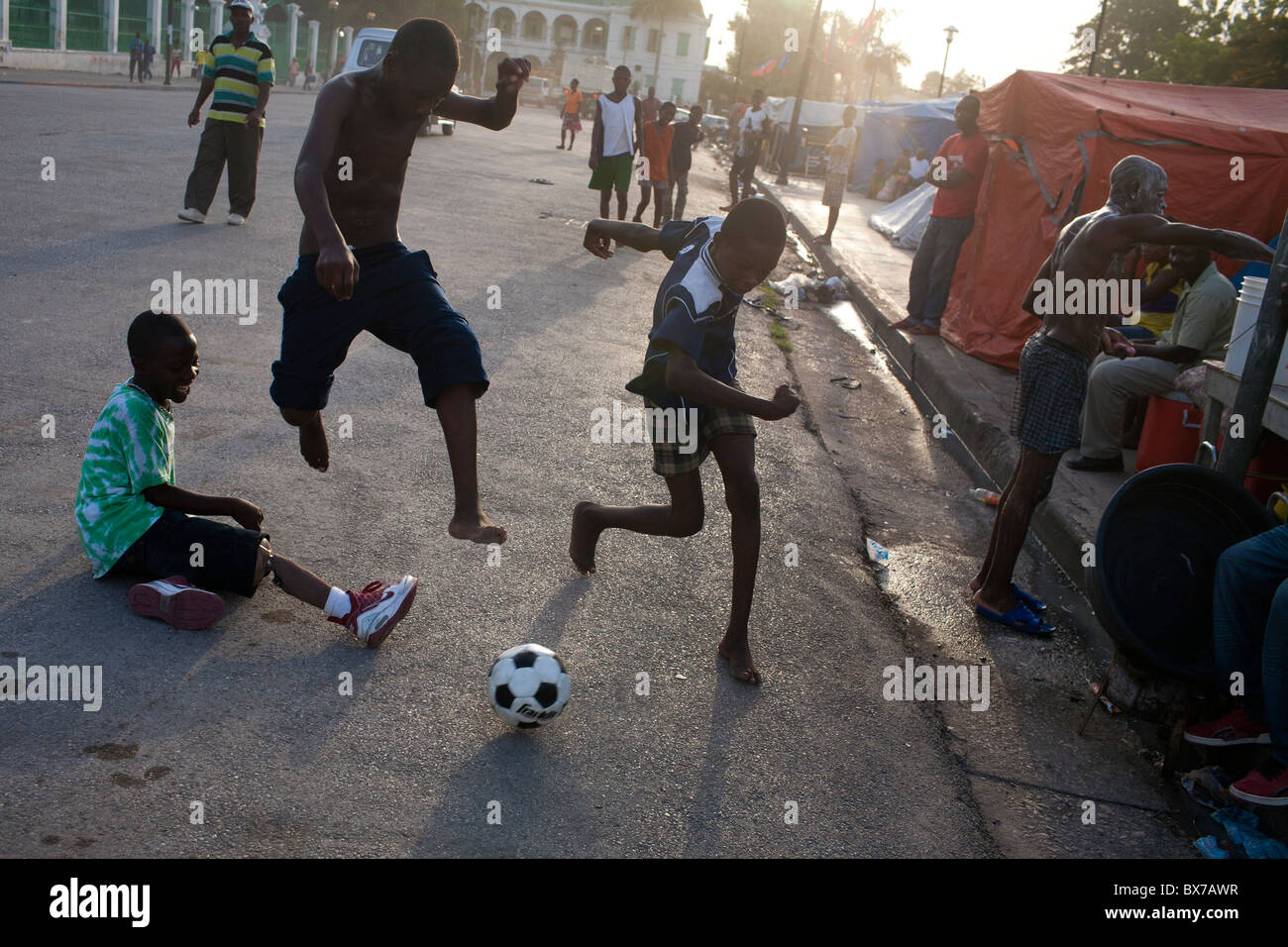 Boys, one of whom lost his leg in the earthquake and has a prosthesis ...