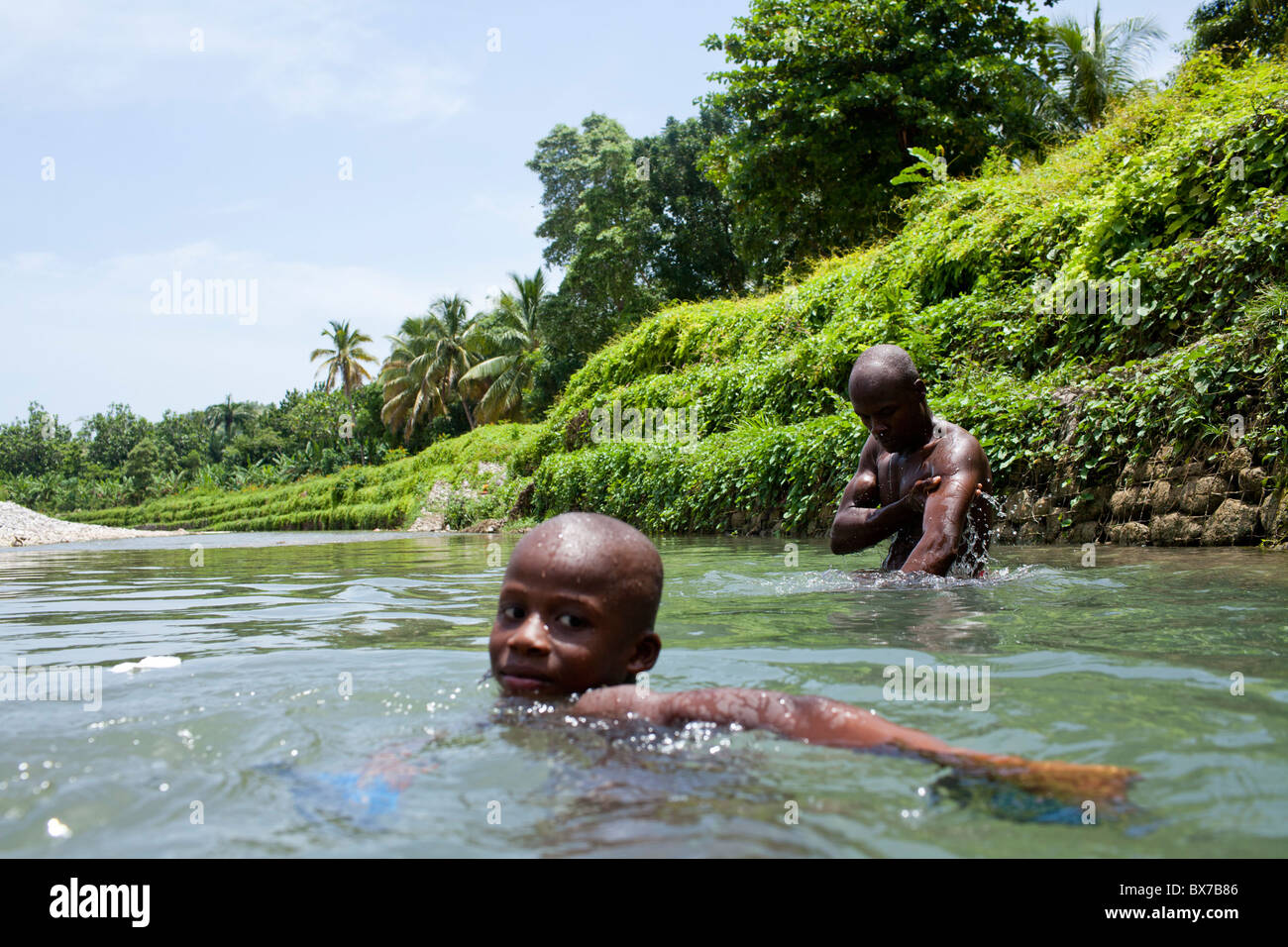 Boys swim in a river on July 16, 2010 in Gador, Haiti Stock Photo - Alamy