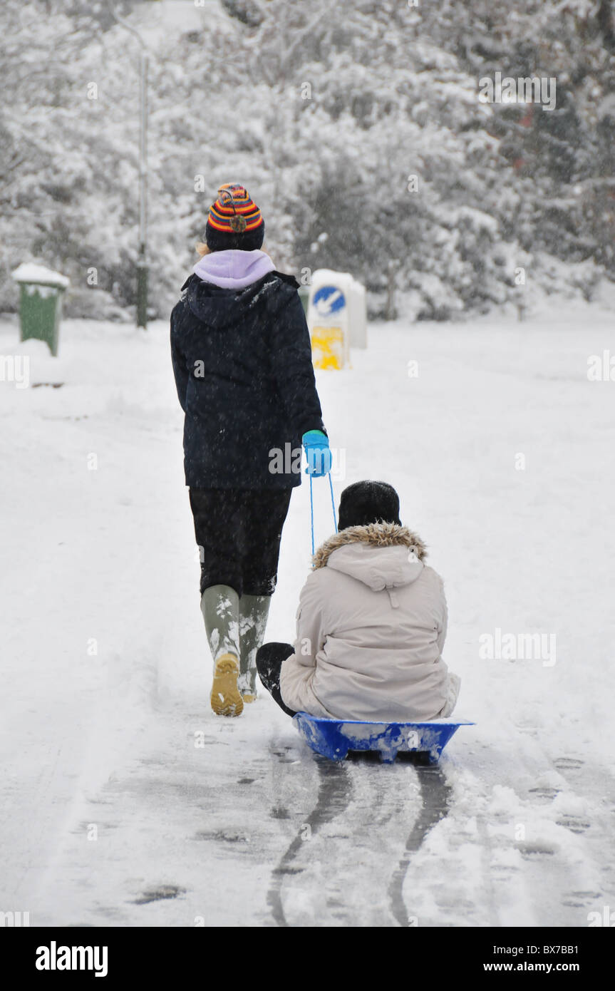 Child pulling a sled hi-res stock photography and images - Alamy