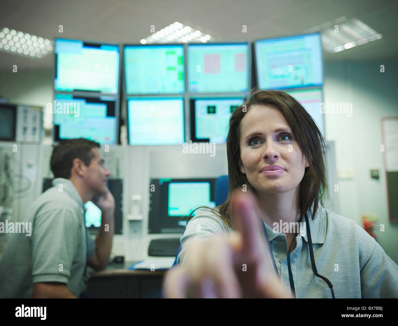 Scientists in accelerator control room hi-res stock photography and ...